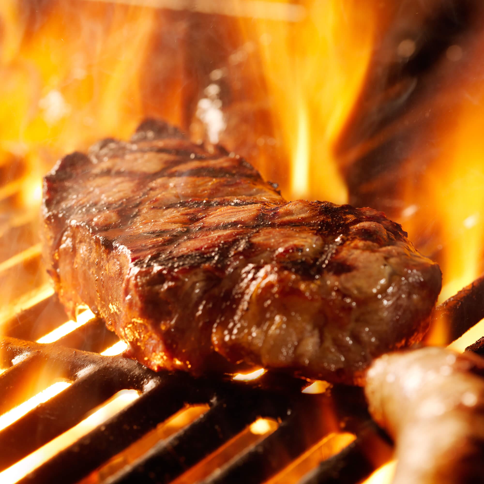 Beef Steak On The Grill With Flames The Butcher Shop Inc Beef Steak On The Grill With Flames The Butcher Shop Inc